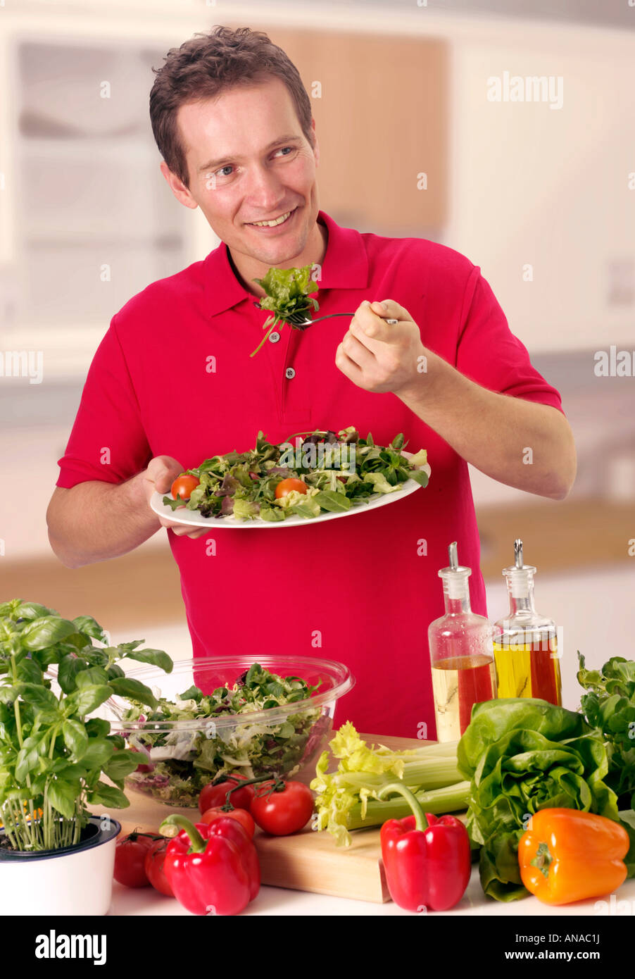 Man eating salad holding hi-res stock photography and images - Alamy
