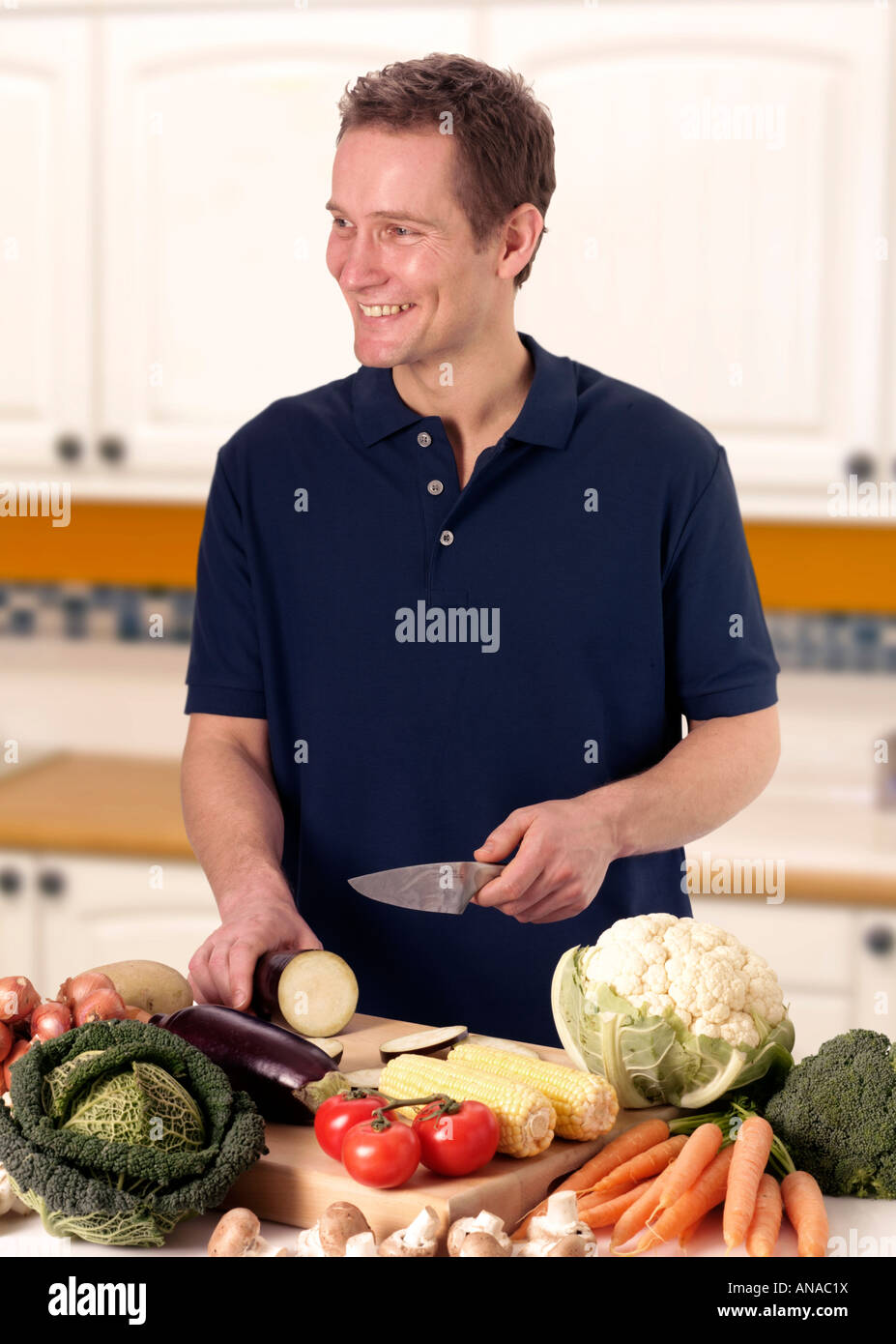 Man cutting vegetables hi-res stock photography and images - Alamy
