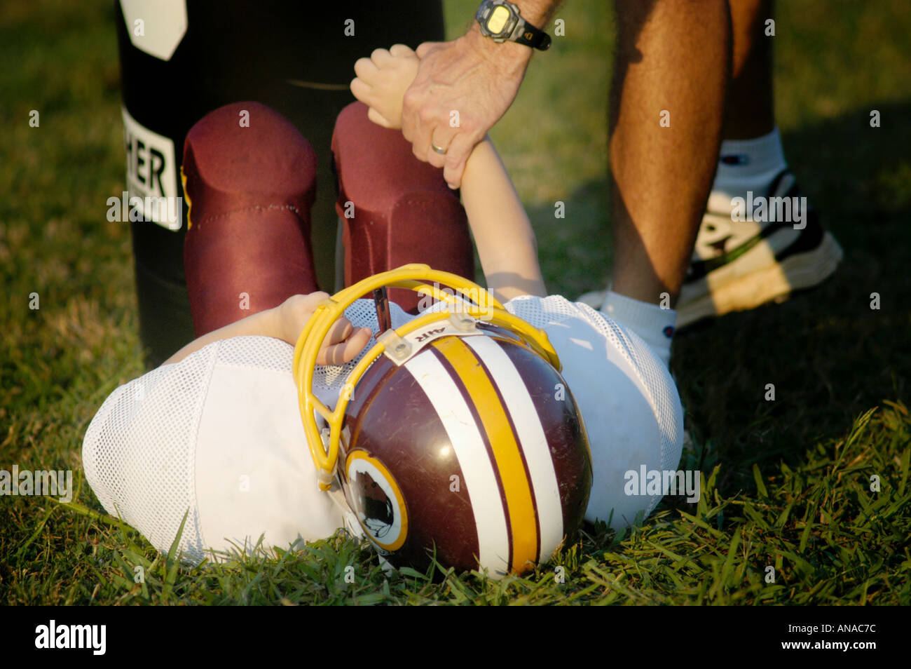 6 year old football player gets a helping hand from coach after slight ...
