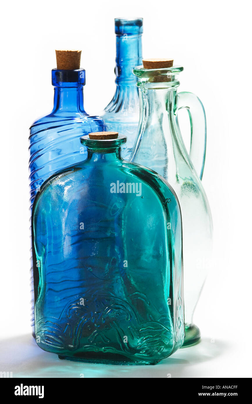 Assorted blue and clear glass containers still life Stock Photo - Alamy
