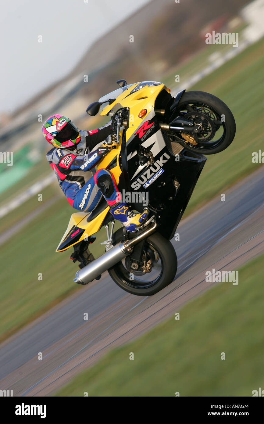 Motorcycles doing stunts including wheelies and jesus christs and ...