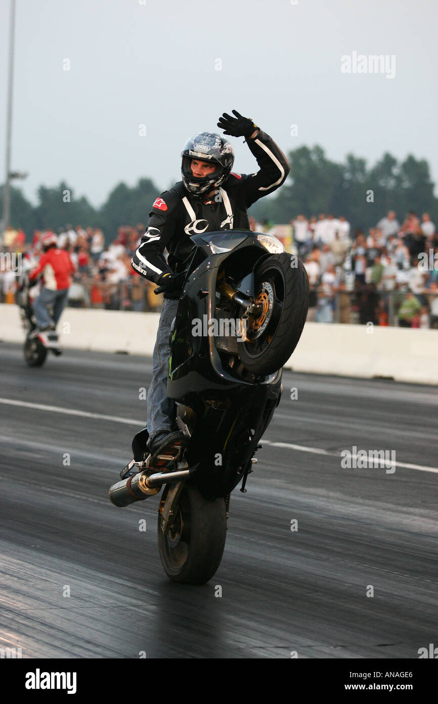 Motorcycles doing stunts including wheelies and jesus christs and ...