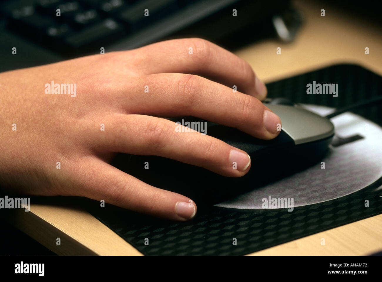 Hand on computer mouse Stock Photo - Alamy