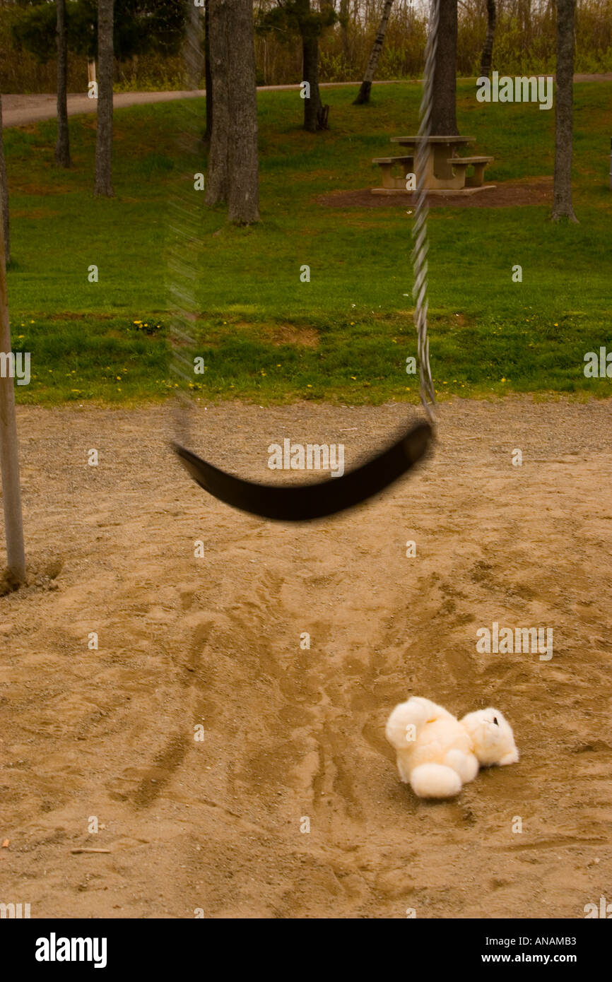 Teddy bear left behind in a park Stock Photo - Alamy