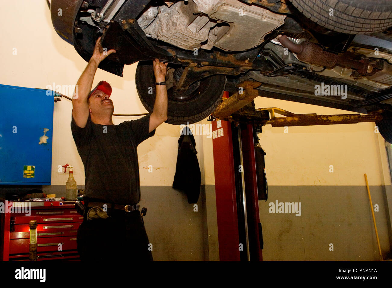 Mechanic working on car Stock Photo - Alamy