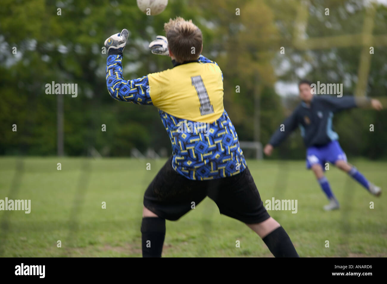 Playing football soccer Stock Photo - Alamy