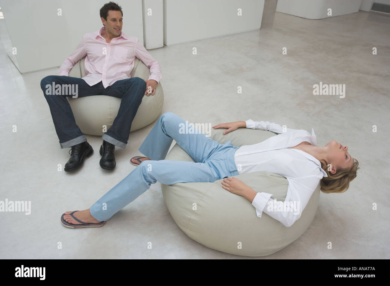Sitting on bean bags hi-res stock photography and images - Alamy