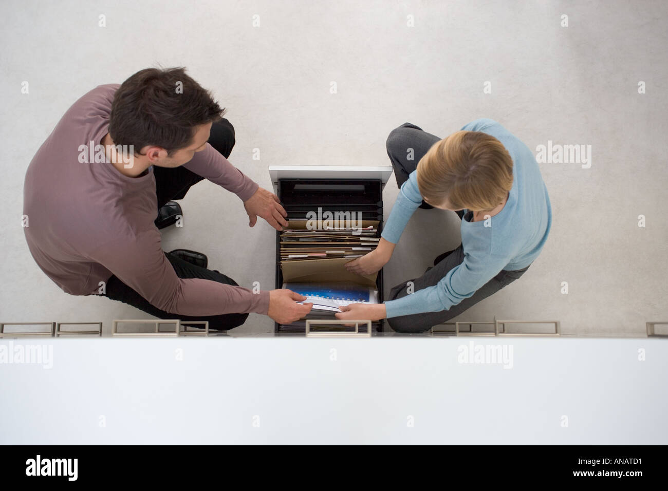 Woman searching through cabinet hi-res stock photography and images - Alamy