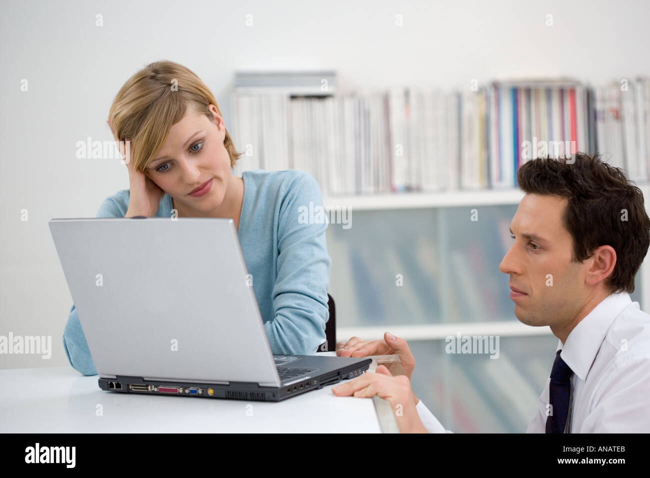 confused looking business people looking at laptop screen Stock Photo ...