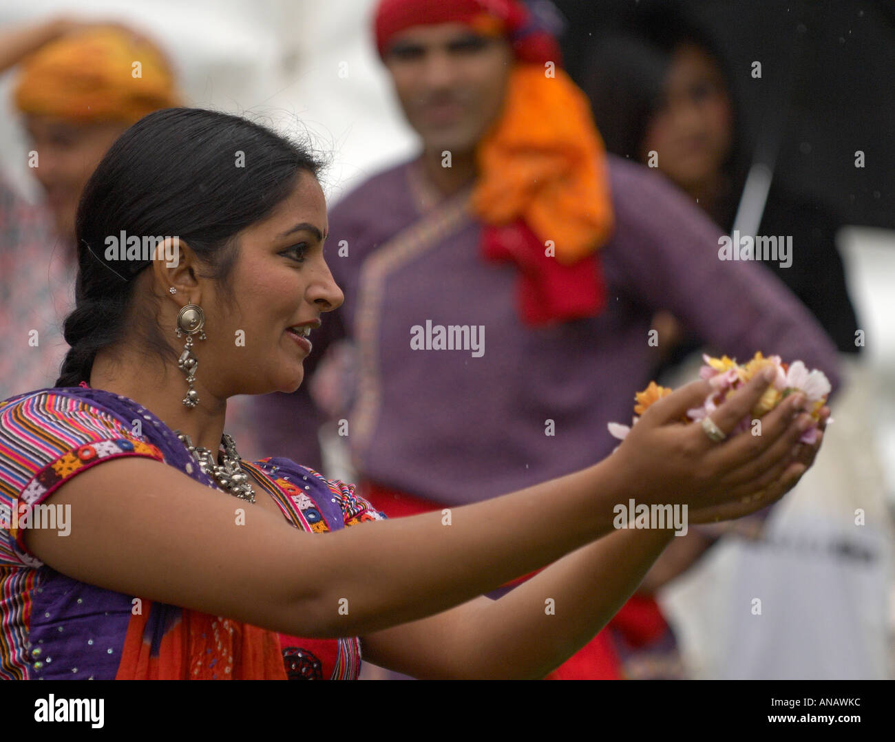 Indian dancer with flowers in her hands Stock Photo - Alamy
