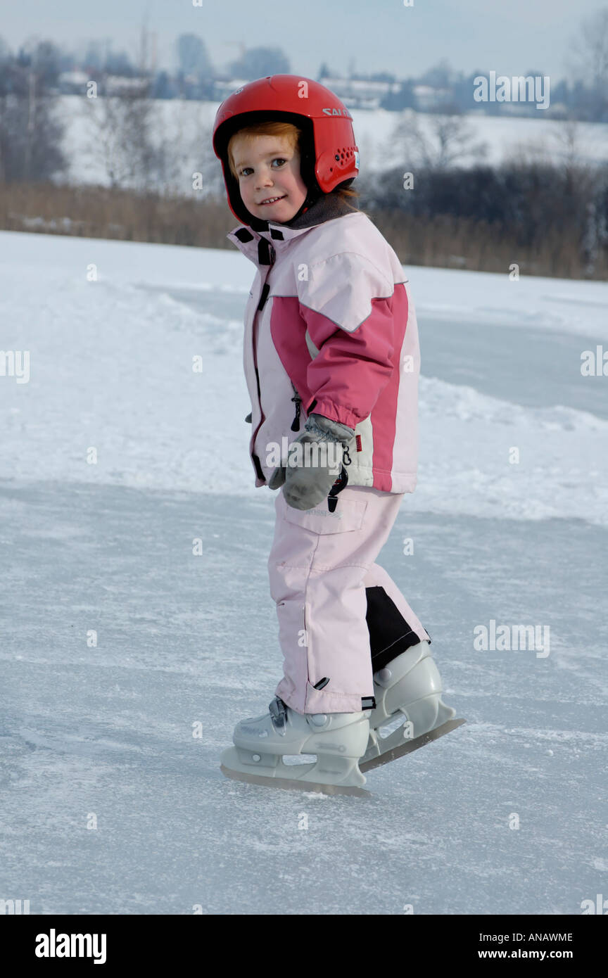 Child ice skating hi-res stock photography and images - Alamy
