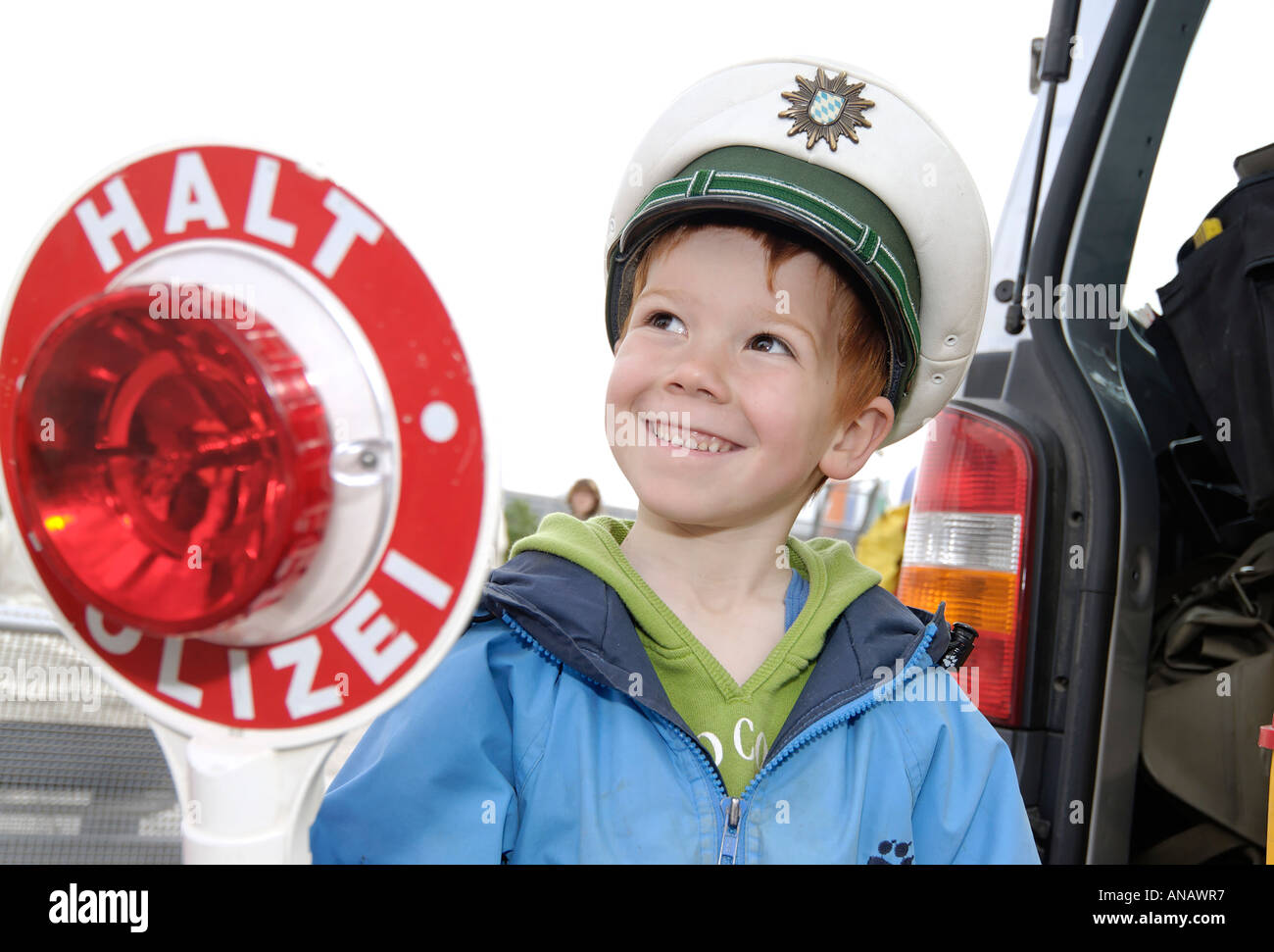 Boy with a german police cap Stock Photo - Alamy
