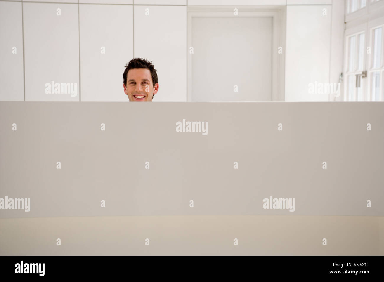 Man behind hotel desk hi-res stock photography and images - Alamy
