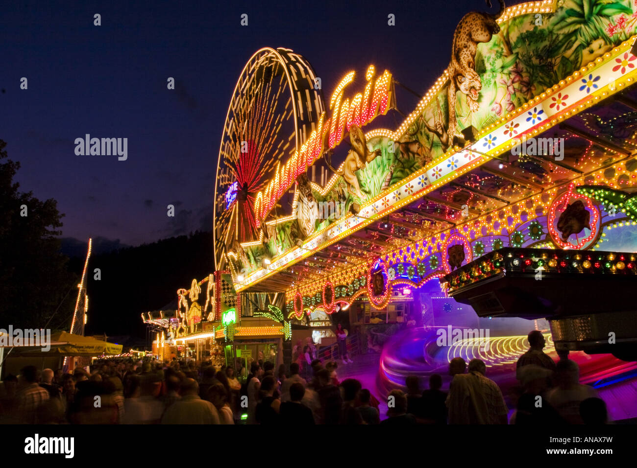 fun fair in the evening, fairground ride and big wheel, Germany, Baden ...
