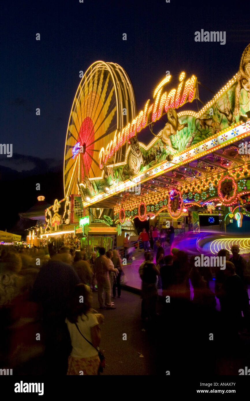 fun fair in the evening, fairground ride and big wheel, Germany, Baden ...