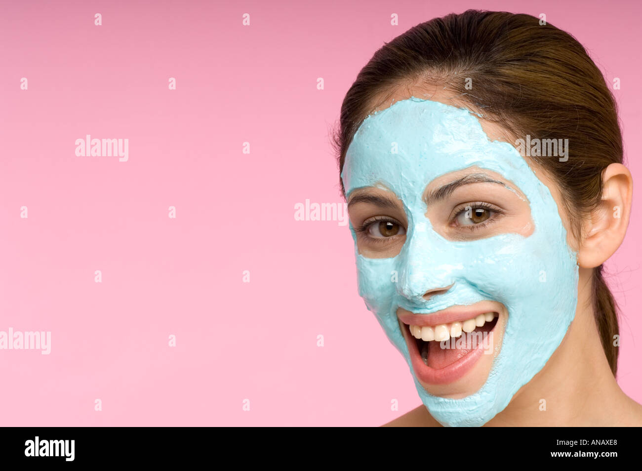 laughing young woman with face mask Stock Photo - Alamy