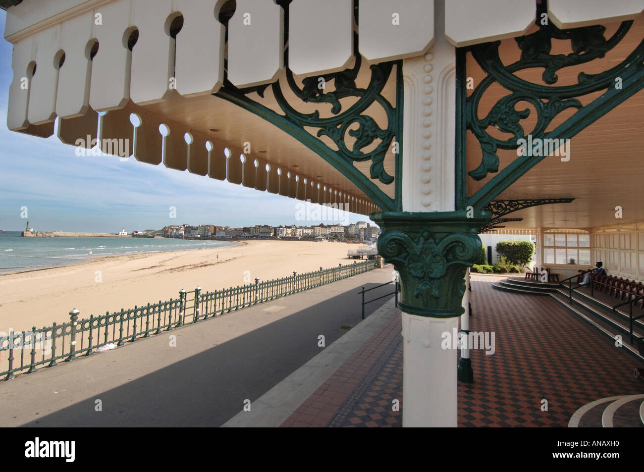 Margate seafront in Kent, seen through an ornate promenade shelter with ...