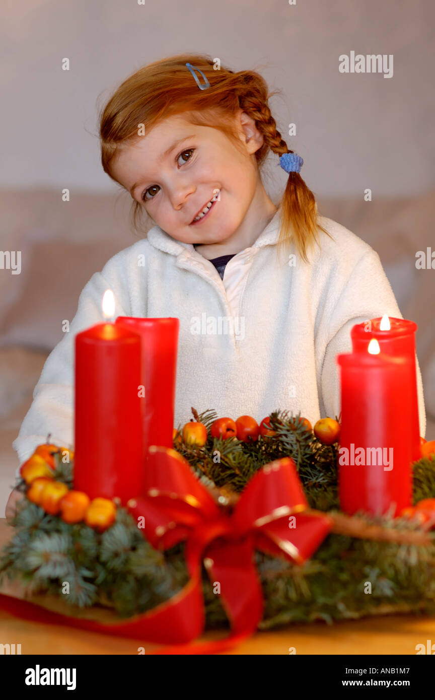 Child with advent wreath with candles Stock Photo - Alamy