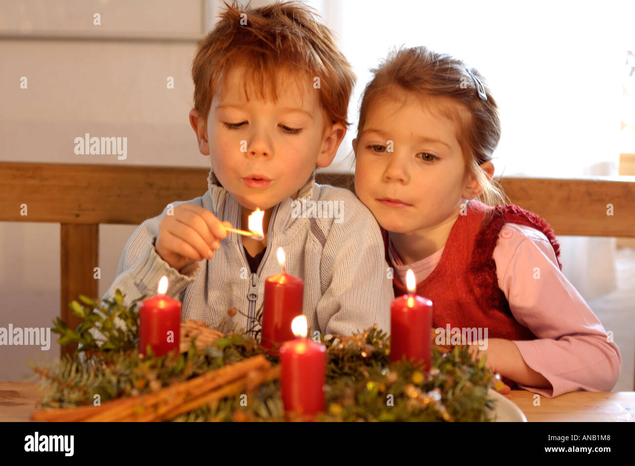 Children with advent wreath hi-res stock photography and images - Alamy