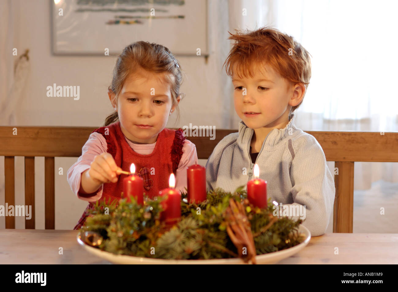 Children in the christmas time with candles and advent wreath Stock ...