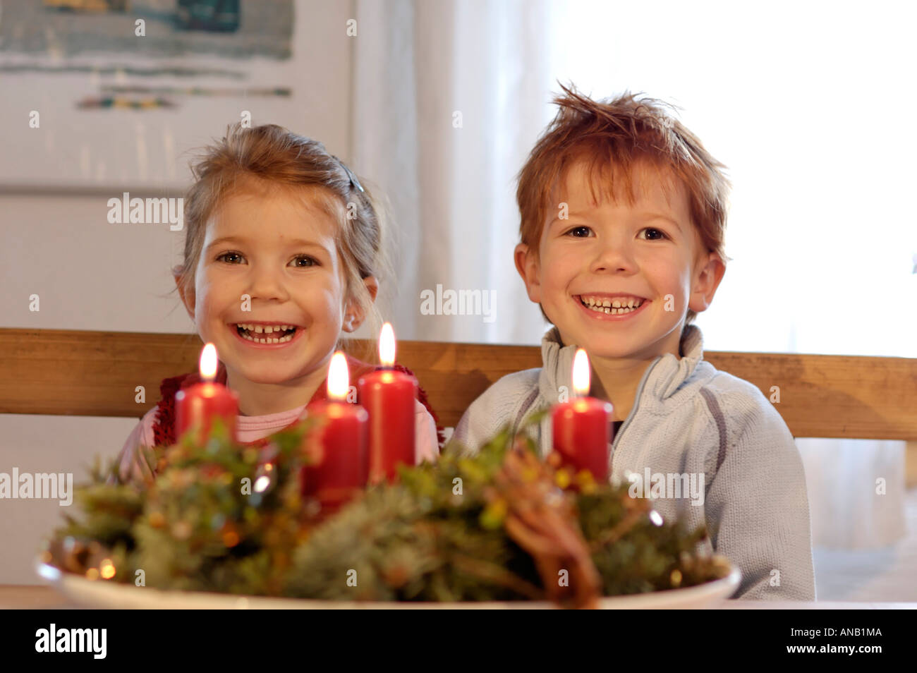 Children in the christmas time with candles and advent wreath Stock ...