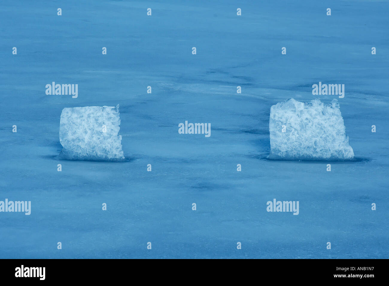 Ice in the water at a lake safety for landing bridges Stock Photo - Alamy