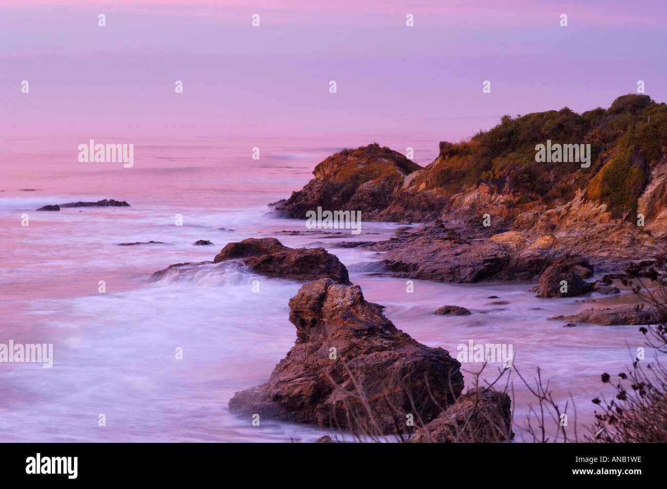Sunrise at the east coast near the town Brighton, Dunedin, South Island ...
