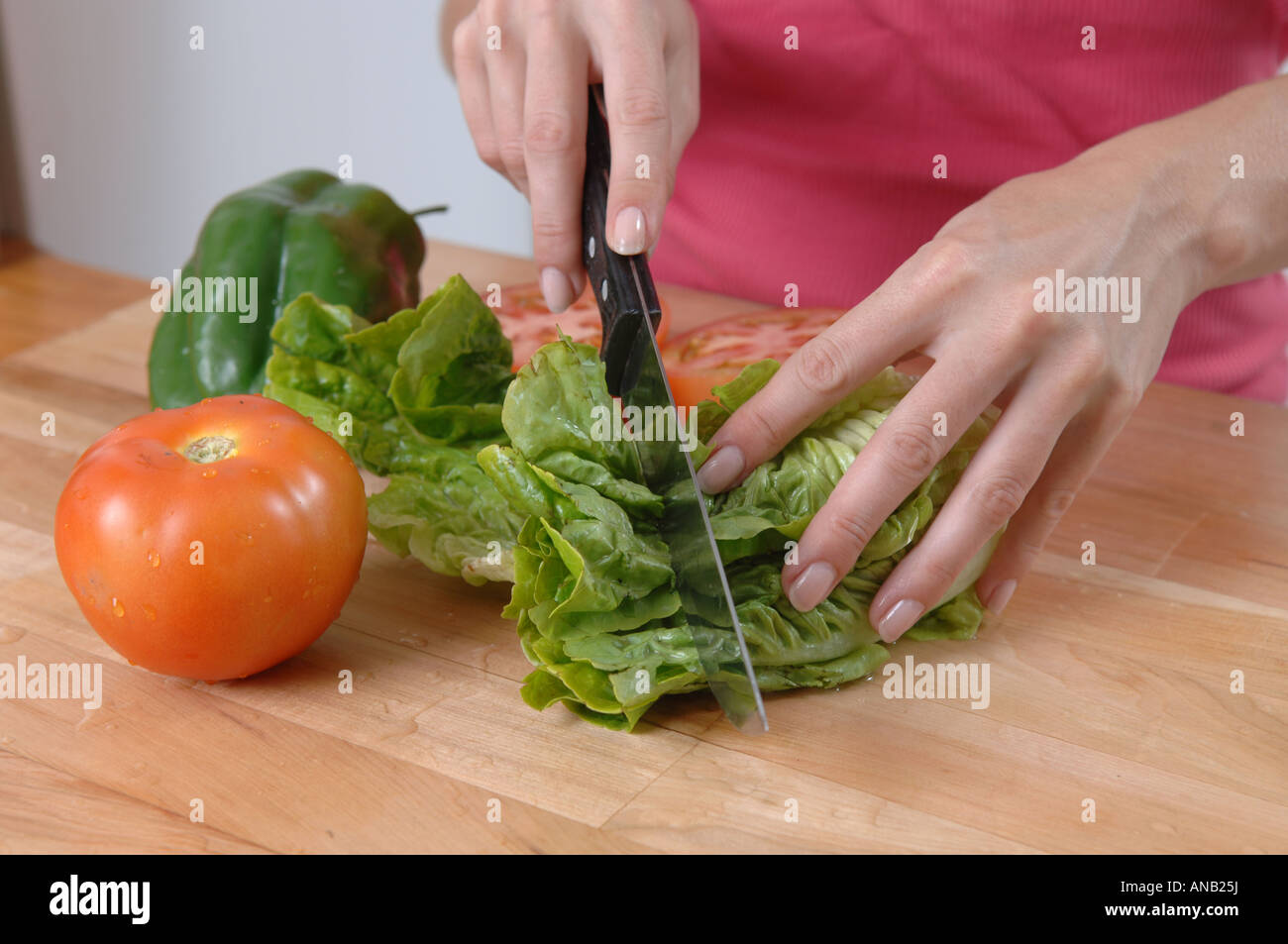 Hands of woman cutting vegetables Stock Photo - Alamy