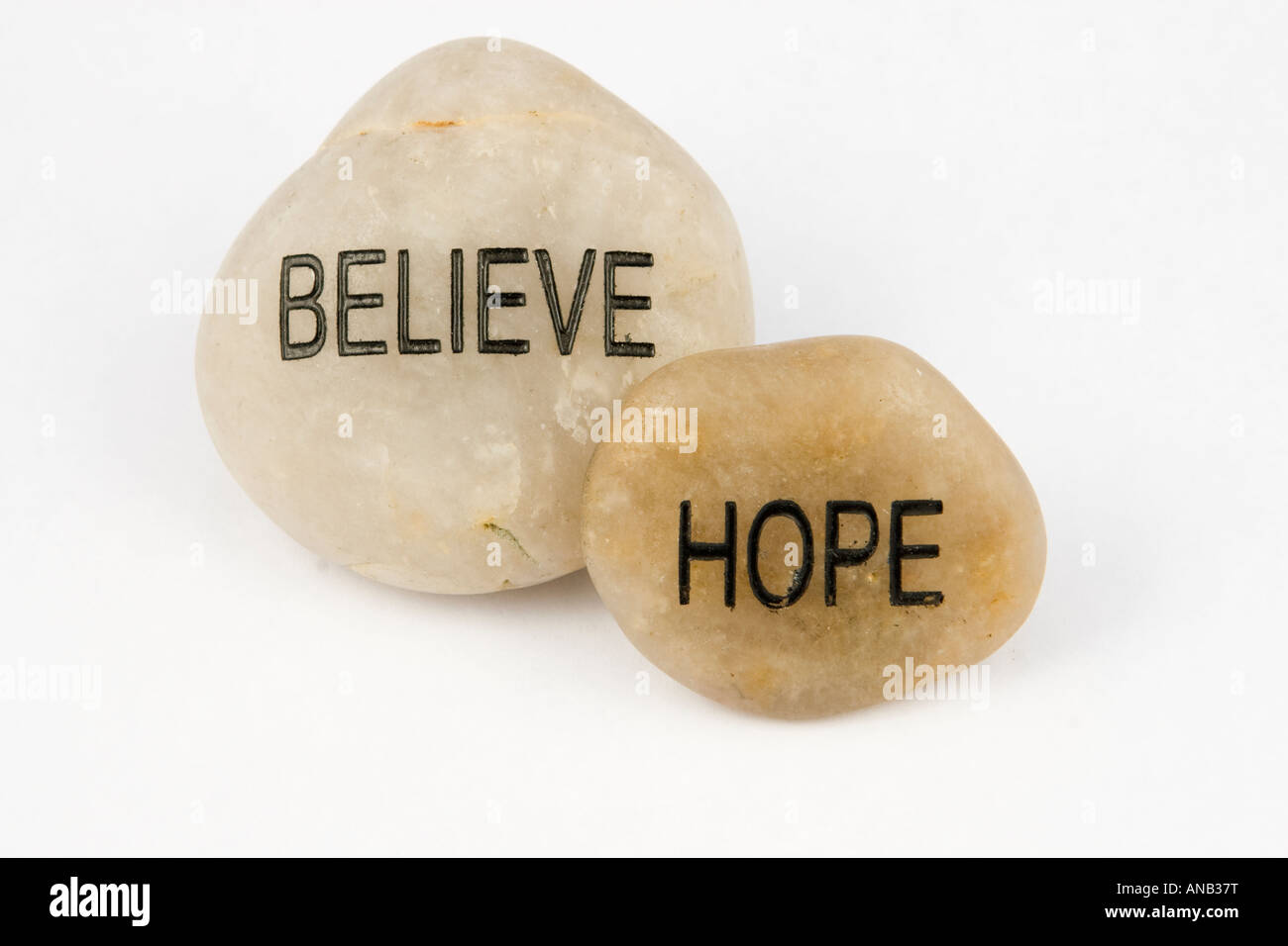 Words on stones: Believe and Hope Stock Photo - Alamy