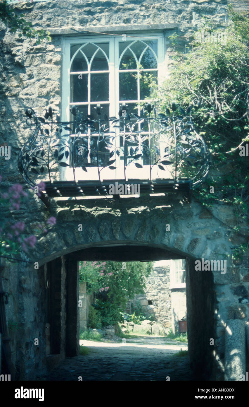 Ornate wrought iron balcony on Gothic window above arch Stock Photo - Alamy