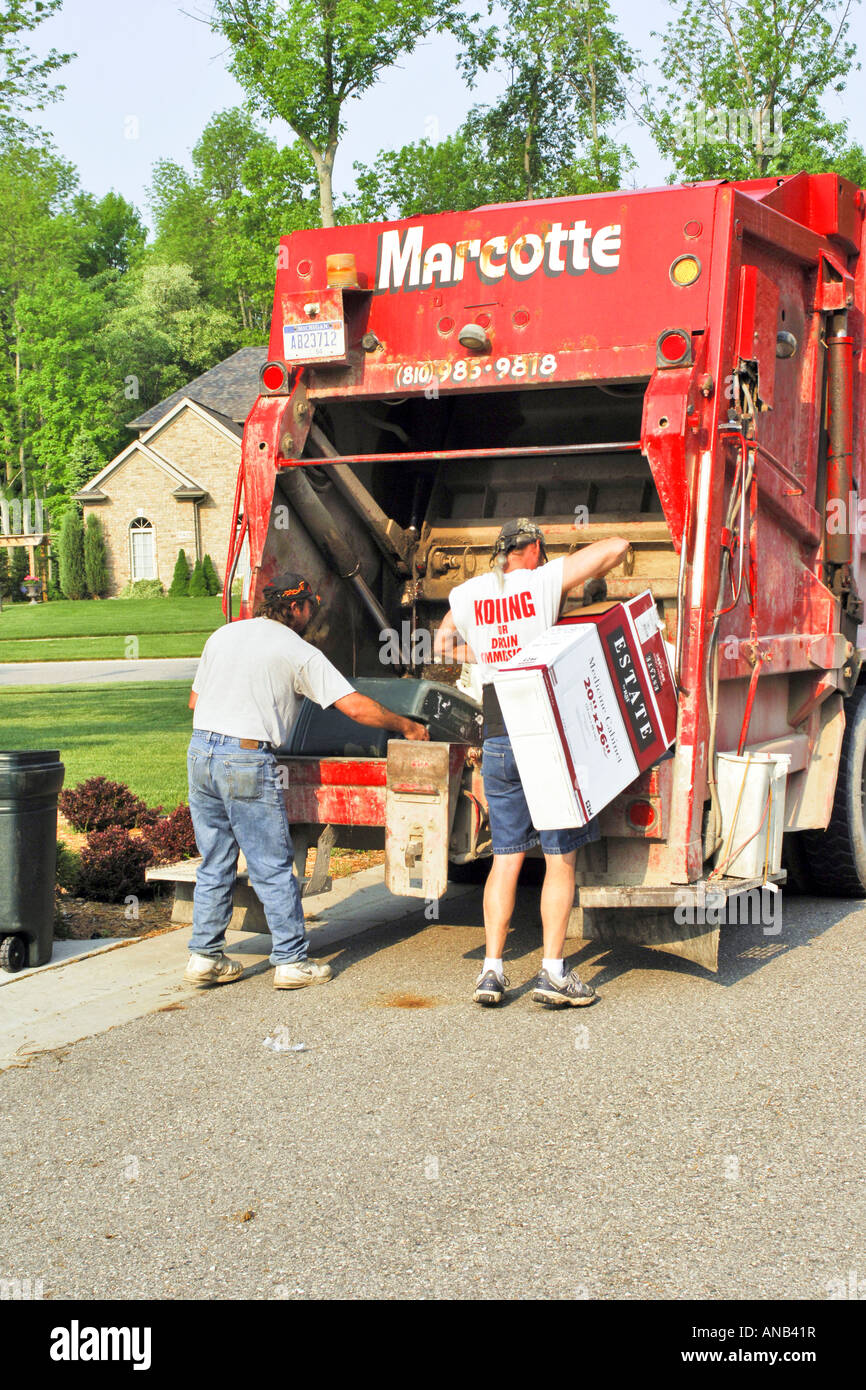 Local Neighborhood rubbish collection workers pick up household trash ...