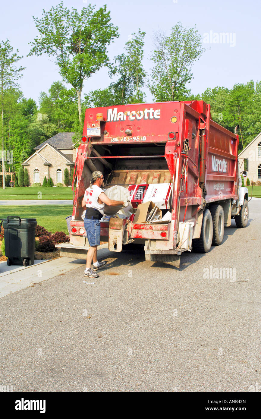Local Neighborhood rubbish collection workers pick up household trash ...