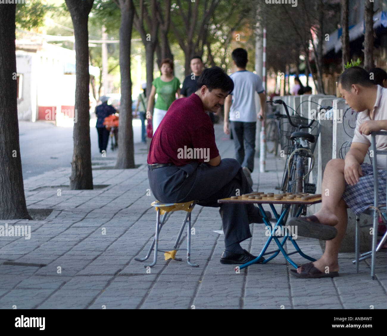 Men playing mahjong hi-res stock photography and images - Alamy