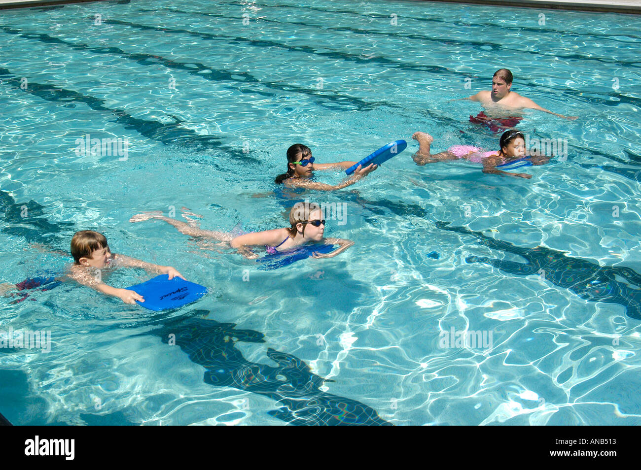 Children Take taking Swimming Lessons at Public Pool Stock Photo - Alamy