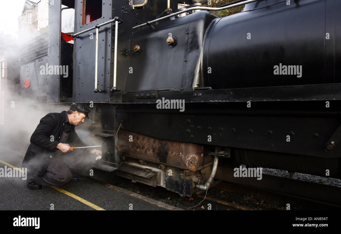 Train driver checks his steam train Stock Photo - Alamy