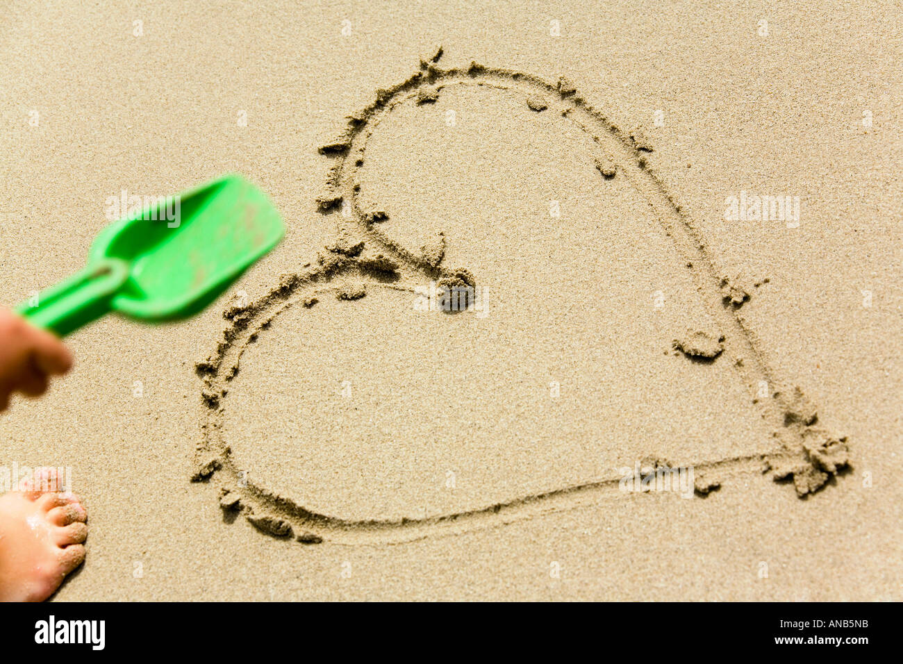 Heart in a sand hi-res stock photography and images - Alamy