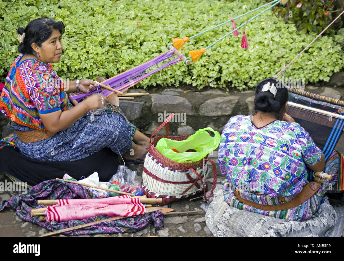GUATEMALA ANTIGUA Cakchiquel Mayan women wearing traditional huipil and ...