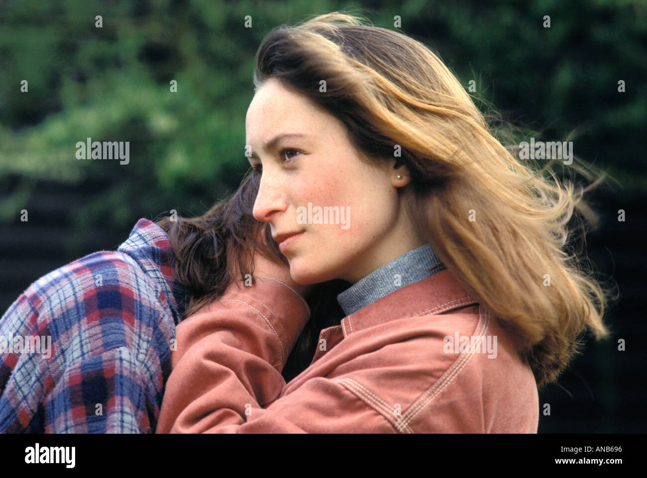 Teenage girl comforts her friend Stock Photo - Alamy