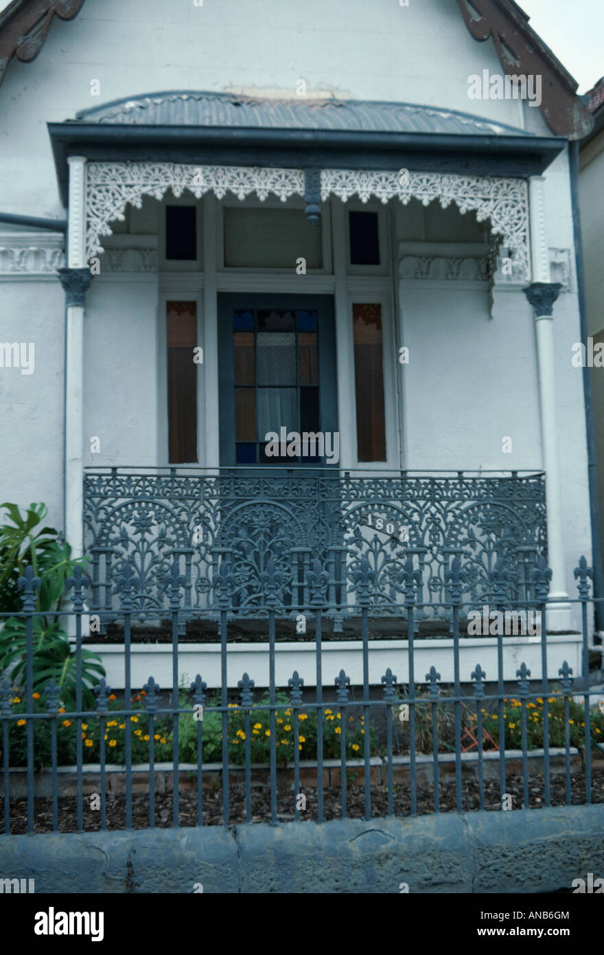 Ornate wrought iron balcony and awning on Victorian townhouse Stock ...