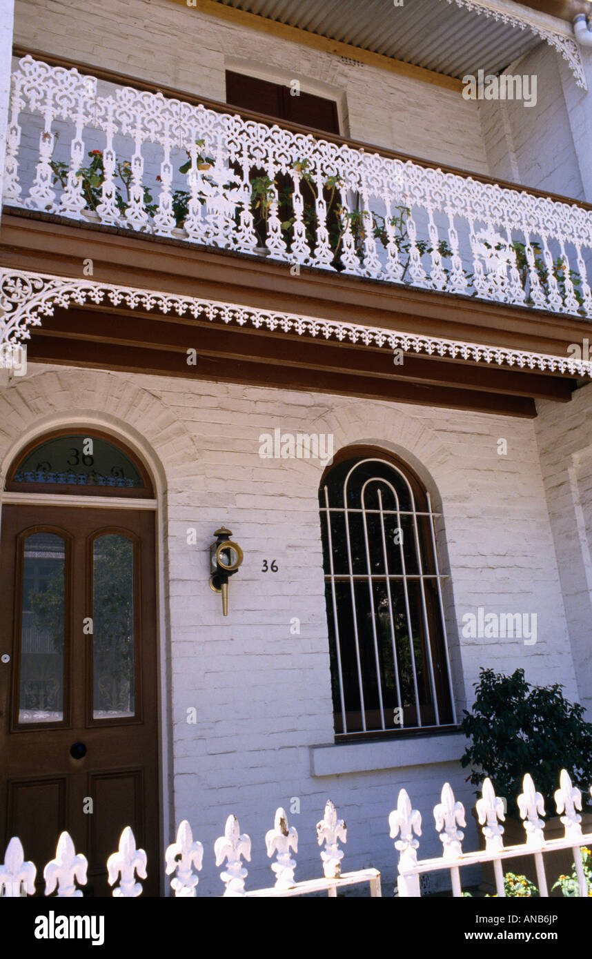 White wrought iron railings and balcony on white Victorian terraced ...
