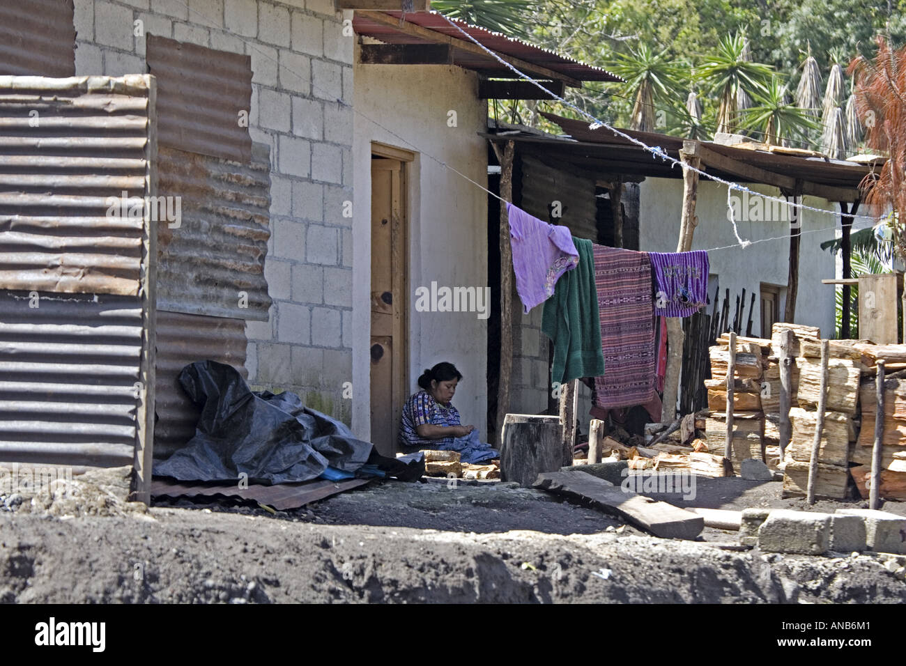 GUATEMALA PANABAJ Indigenous Mayan Tzutujil woman sewing outside her ...