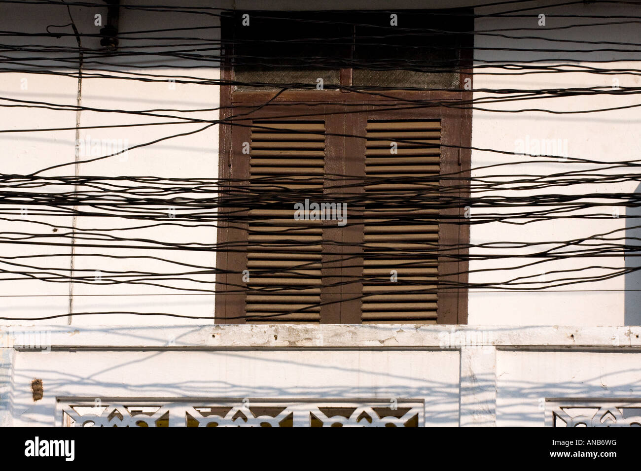 Shuttered window with wires Stock Photo - Alamy