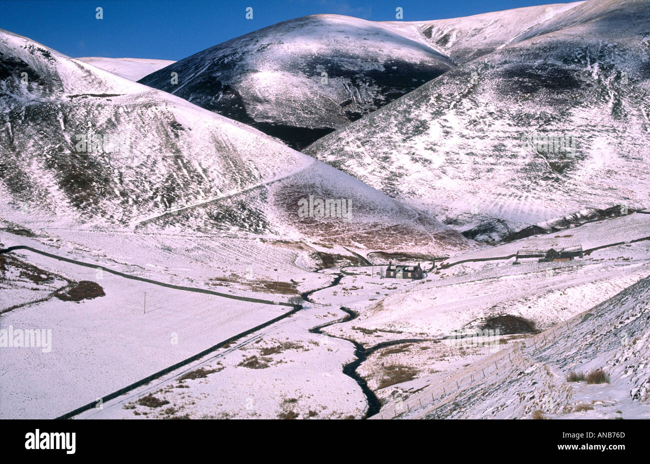 Winter snow in Lowther Hills Small lonely isolated house overshadowed ...