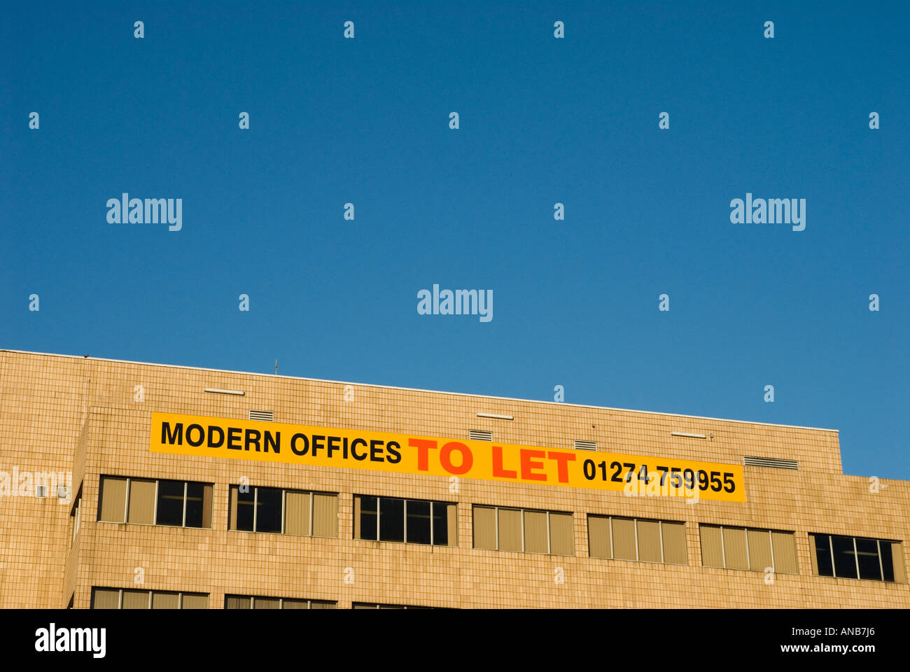 Modern offices to let sign on the top of an office block Stock Photo ...