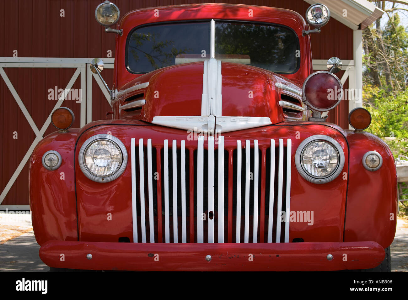 Antique fire engine in front of a red barn Stock Photo - Alamy