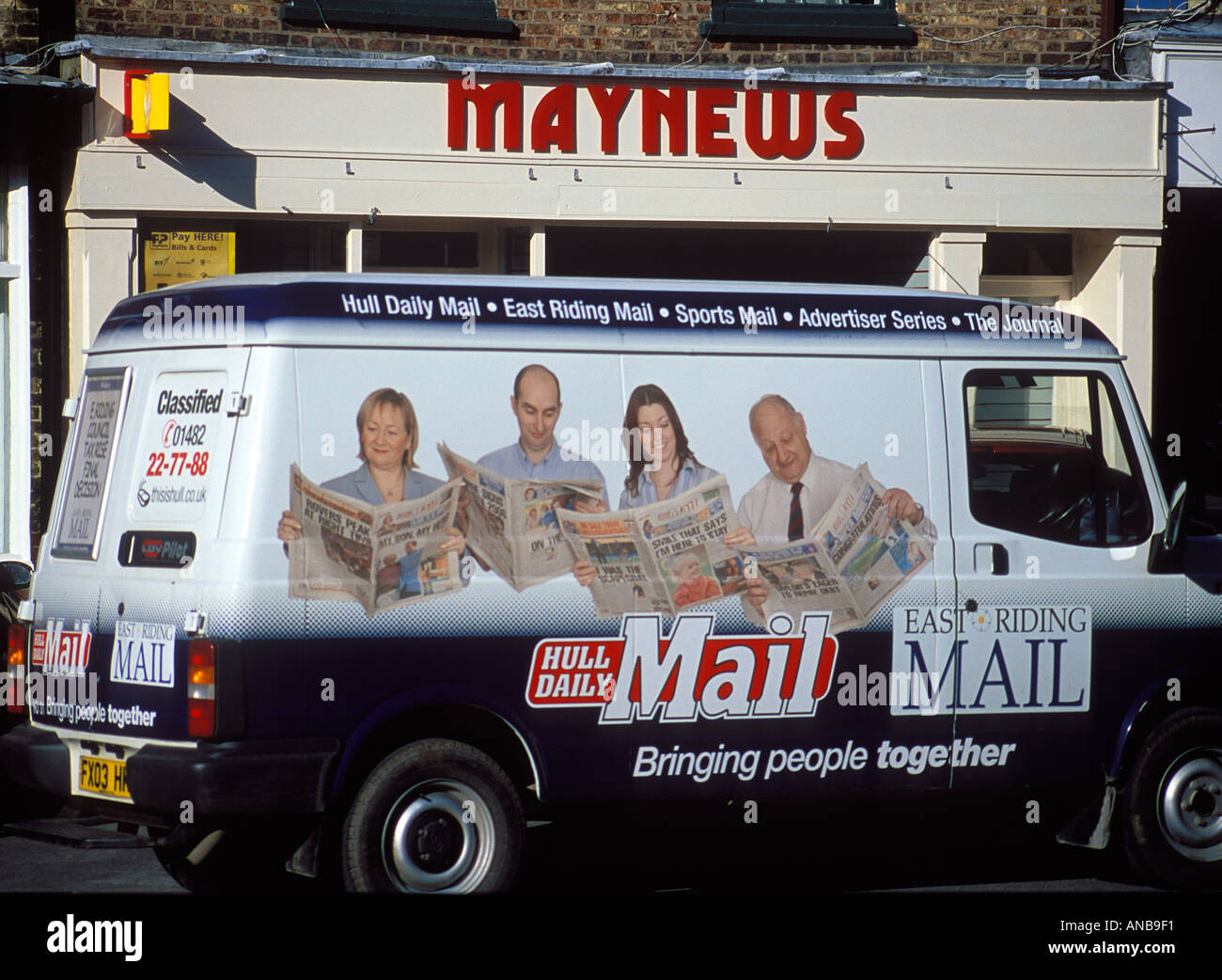 News van outside News shop with picture of people reading newspapers on ...
