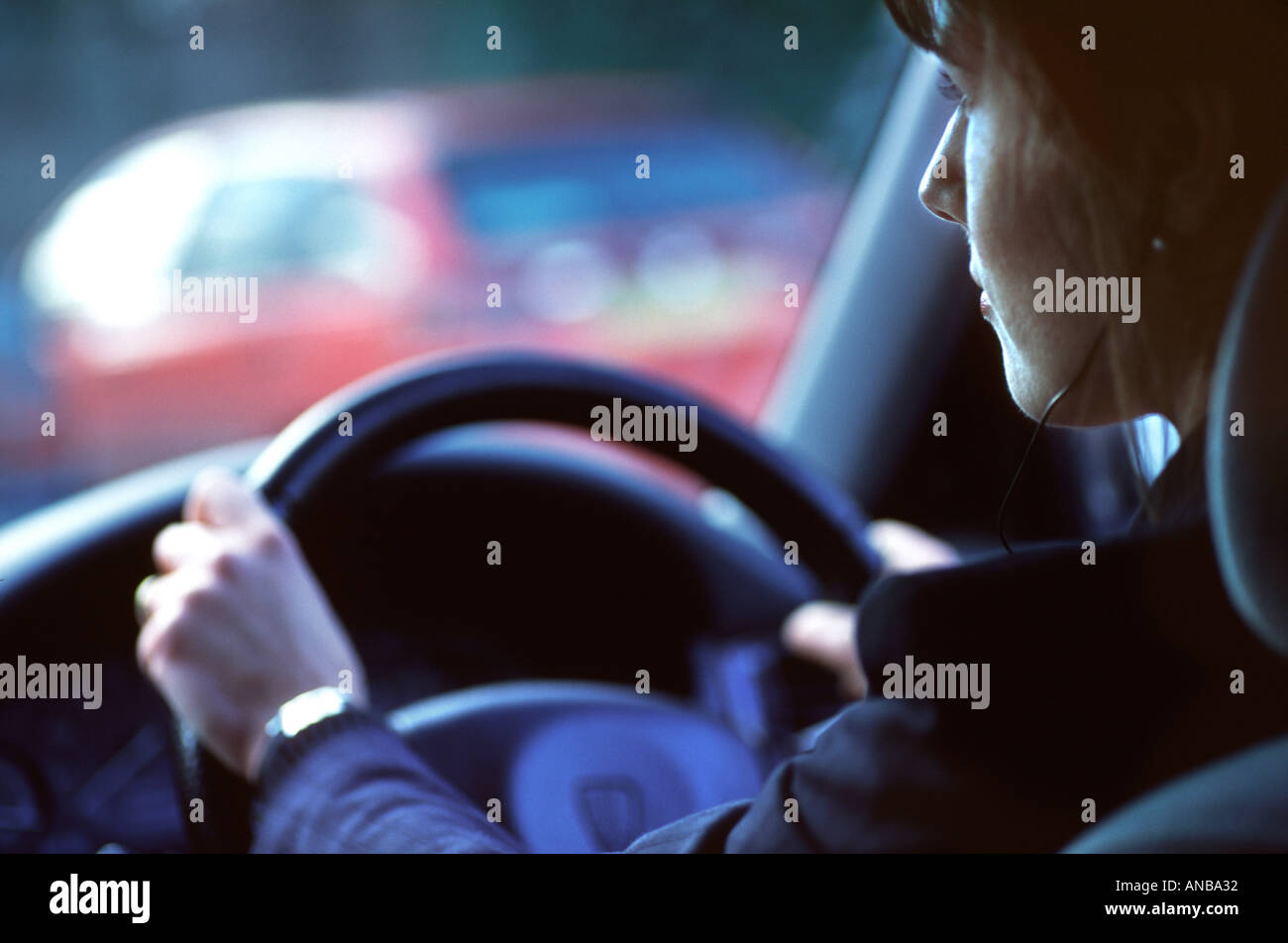 Young business woman driving a right hand drive car Stock Photo - Alamy