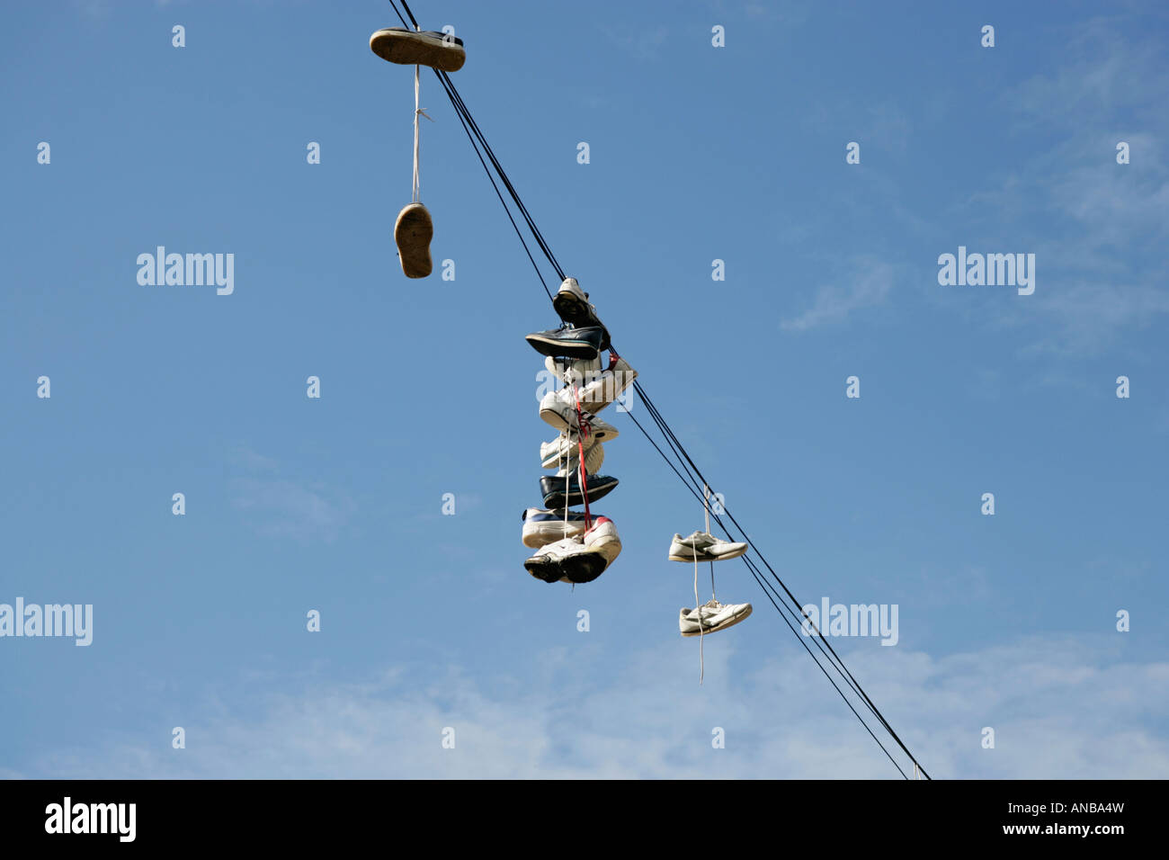 Shoes hanging from telephone wires hi-res stock photography and images ...