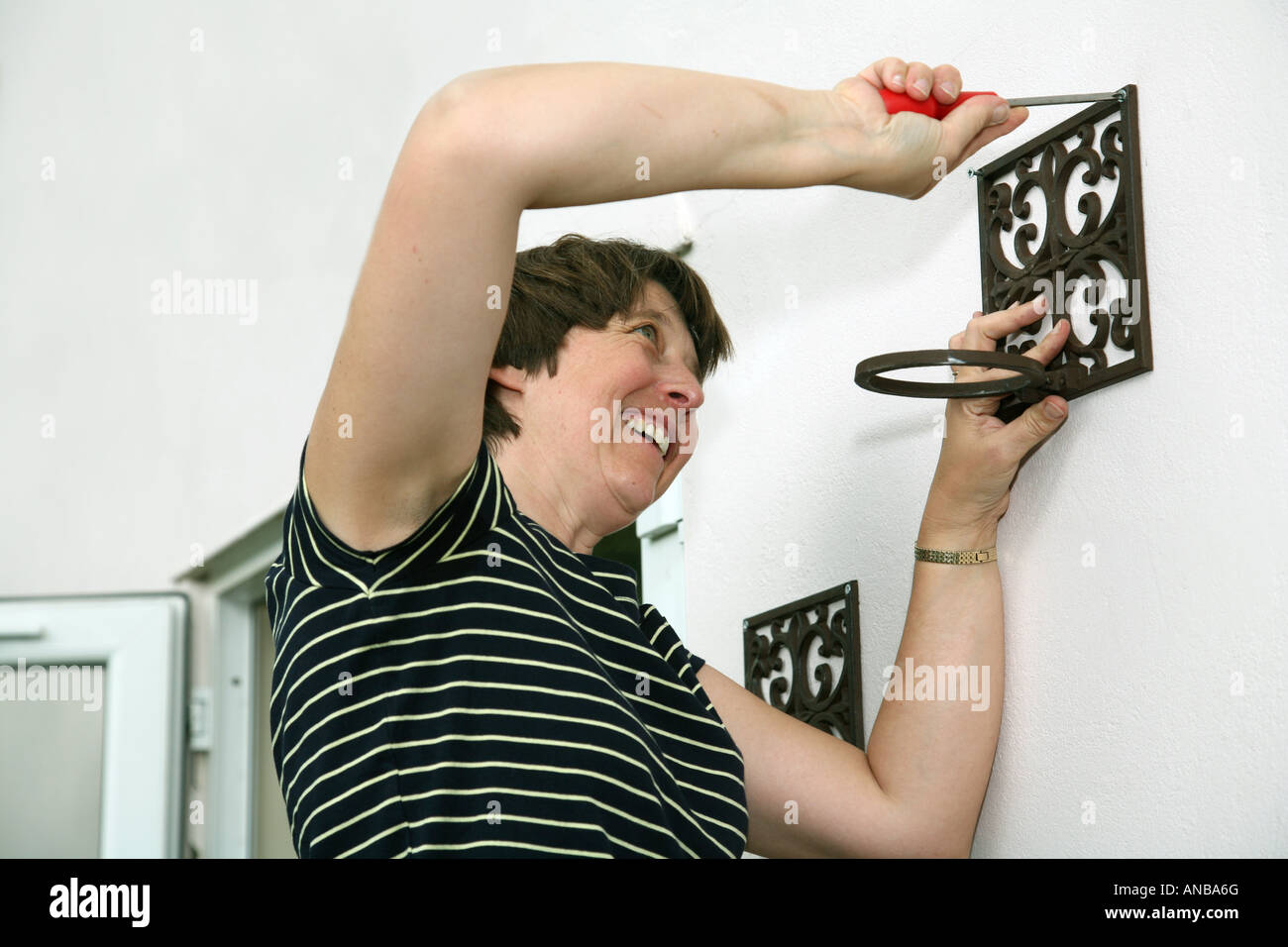 Woman DIY - Woman about the house doing DIY home improvements, UK Stock ...