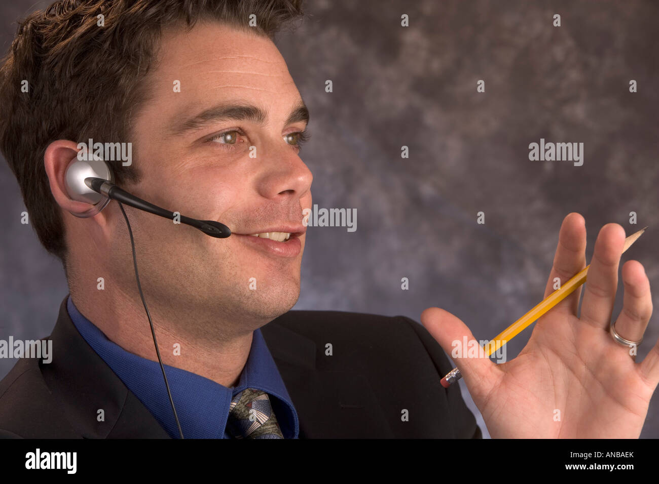 Man with hands free head set phone as telemarketer Stock Photo - Alamy